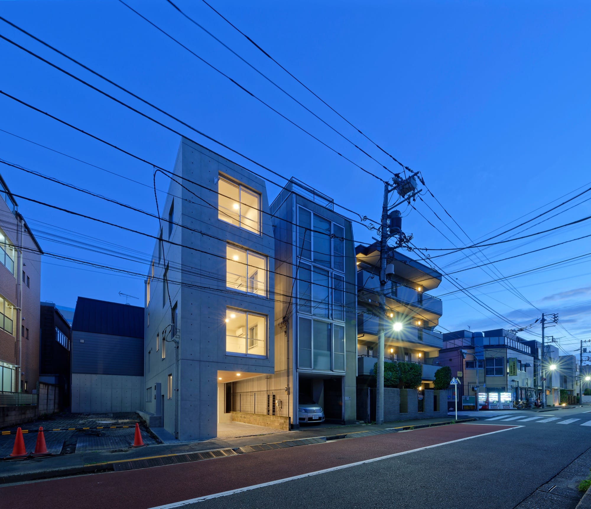 Minimalist concrete apartments fill a narrow site in Tokyo, designed by ...