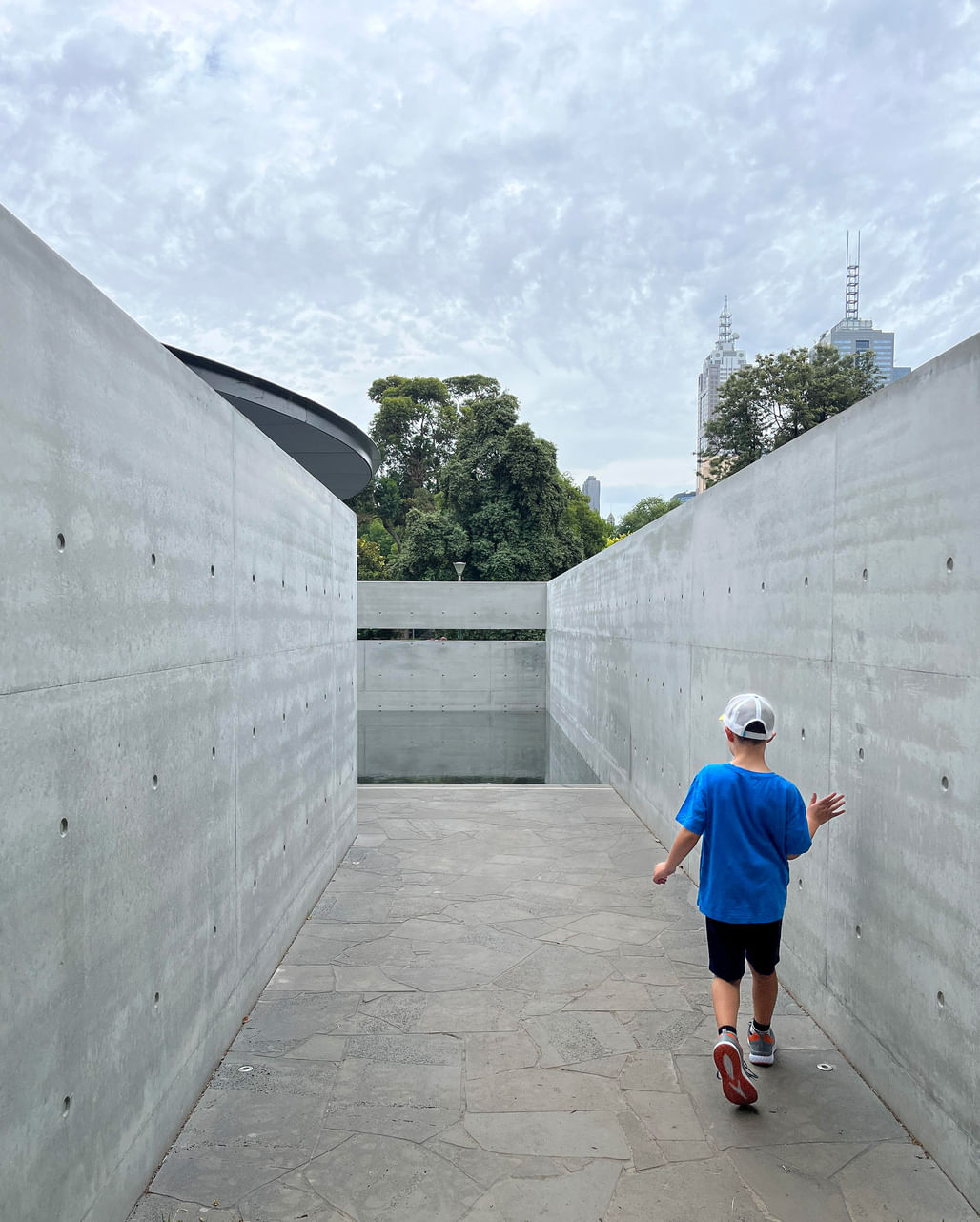 Art performance at Tadao Ando's concrete MPavilion features grayscale ...