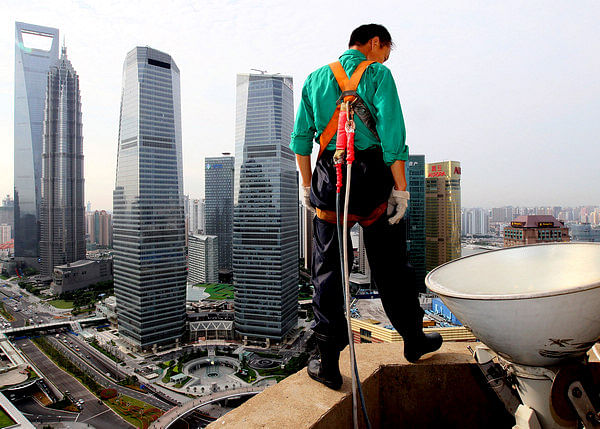 China Relaxes Restrictions On Who Gets Perks Of Urban Public Services