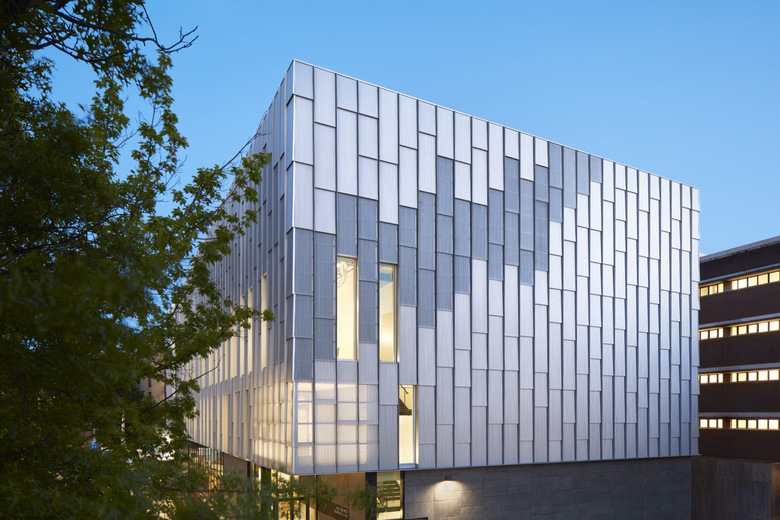 A ‘textural and reflective building skin’ wraps the University of ...