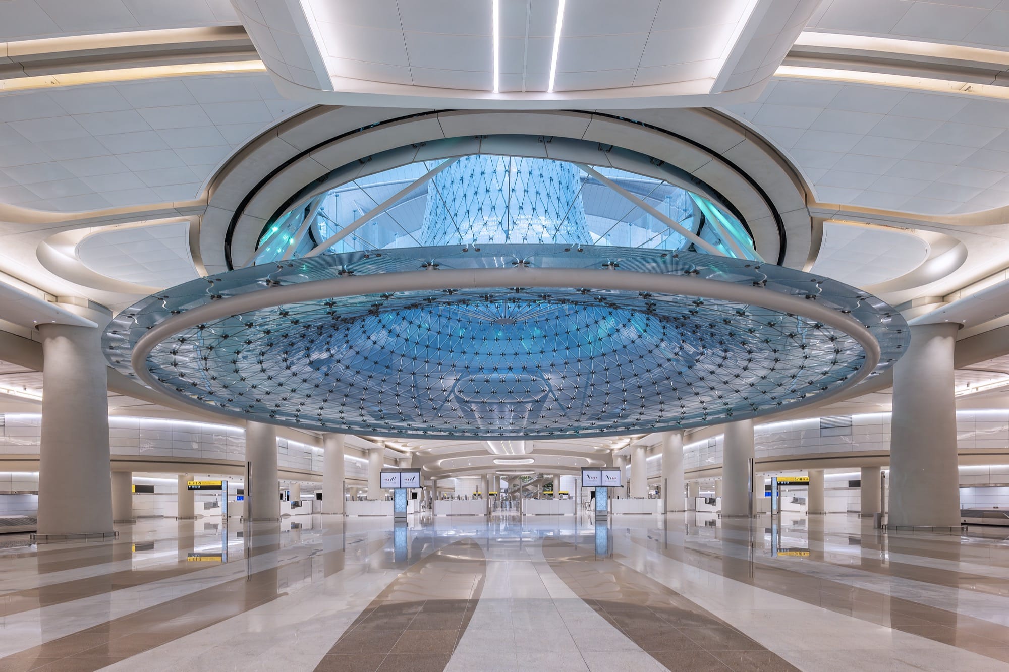 KPF completes Abu Dhabi airport inspired by undulating sand dunes ...