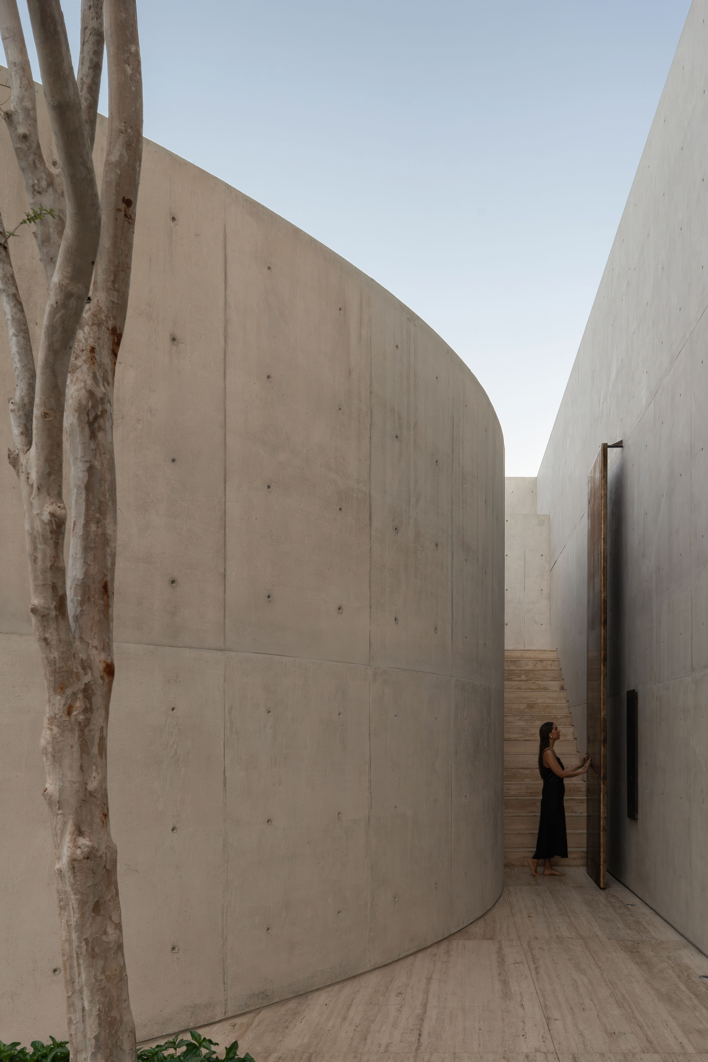 A minimalist concrete home defined by shaded courtyards and stillness ...