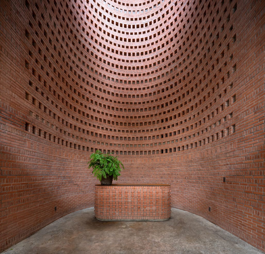A perforated brick facade wraps Tropical Space’s new Ho Chi Minh City ...