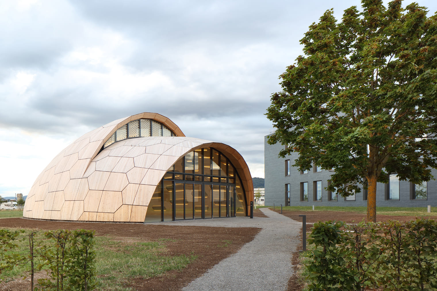 Robots assemble a domed timber pavilion designed by the universities of ...