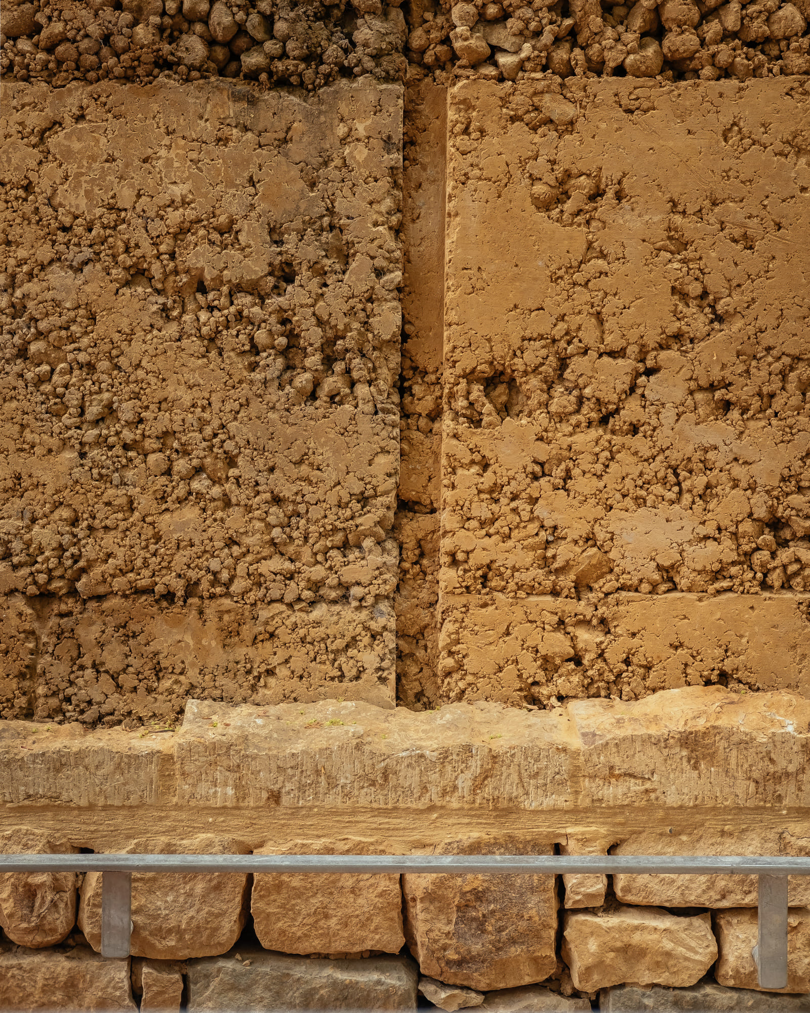 Invisible Studio creates rammed stone yoga studio in UK countryside ...