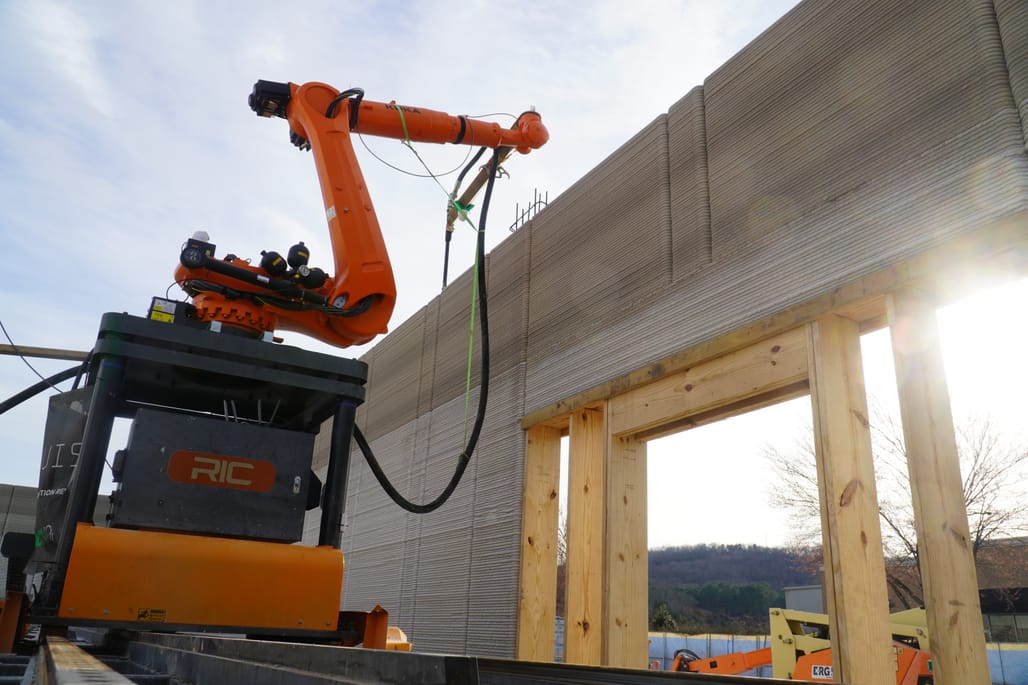 Watch these construction robots 3D print a Walmart extension in just ...