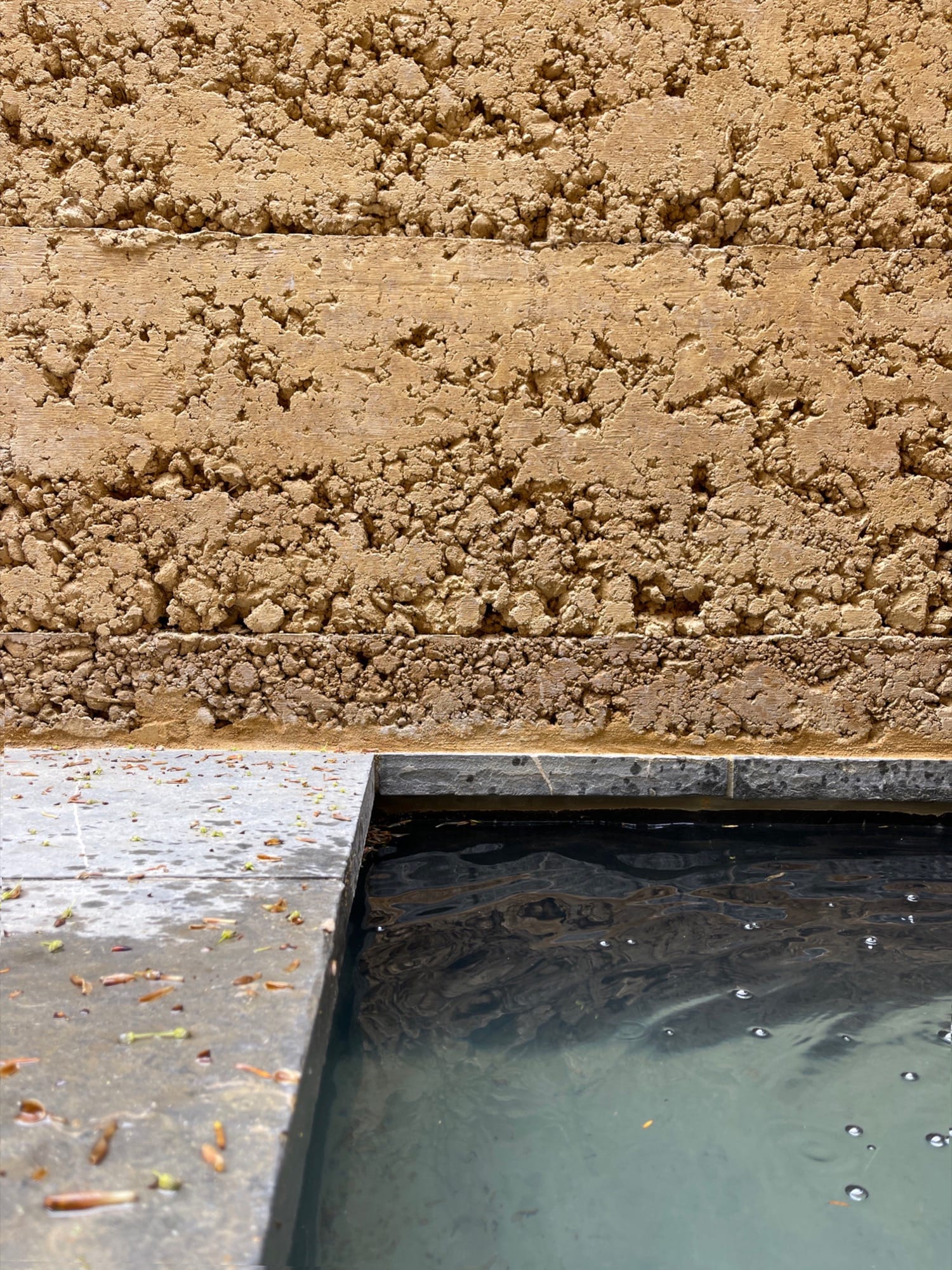 Invisible Studio creates rammed stone yoga studio in UK countryside ...