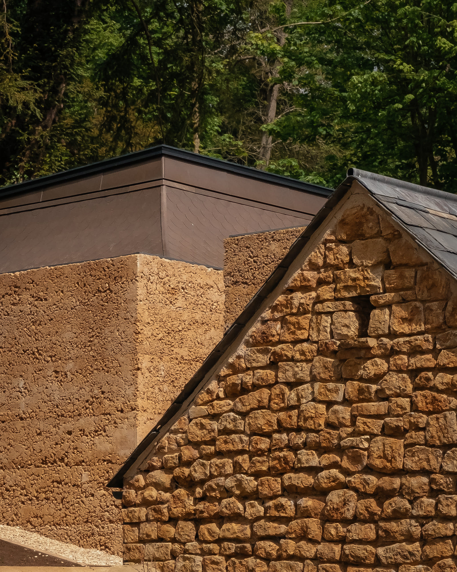 Invisible Studio creates rammed stone yoga studio in UK countryside ...