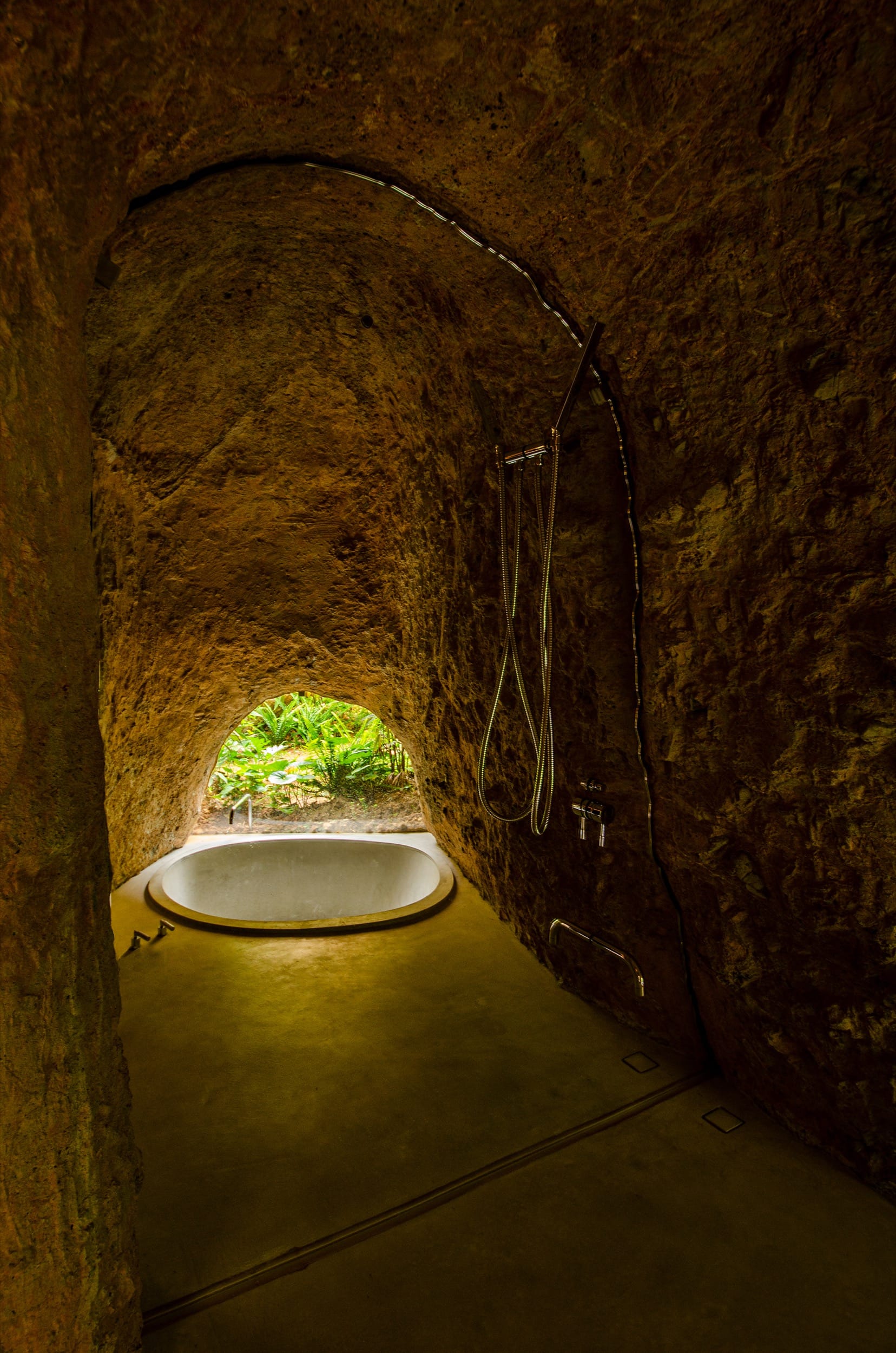 Junya Ishigami 'excavates' concrete cave for restaurant and residence ...