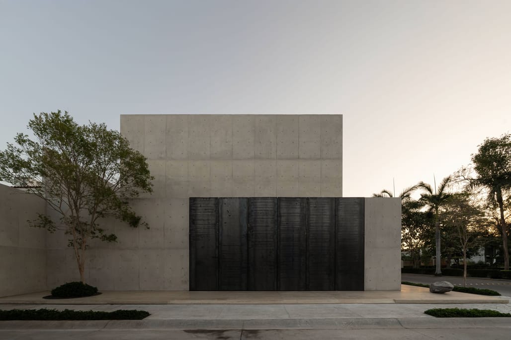 A minimalist concrete home defined by shaded courtyards and stillness ...