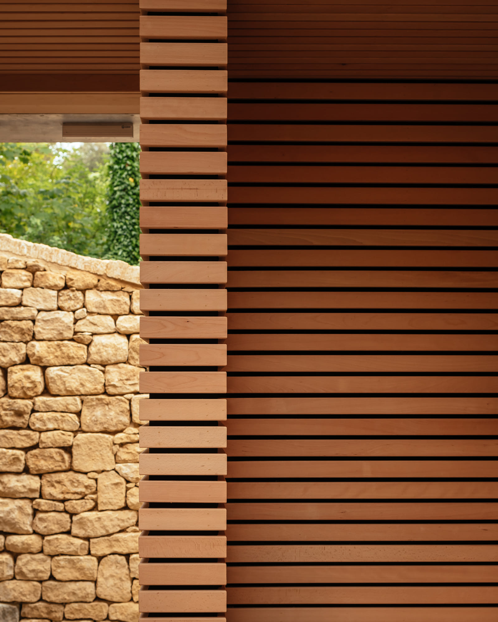 Invisible Studio creates rammed stone yoga studio in UK countryside ...