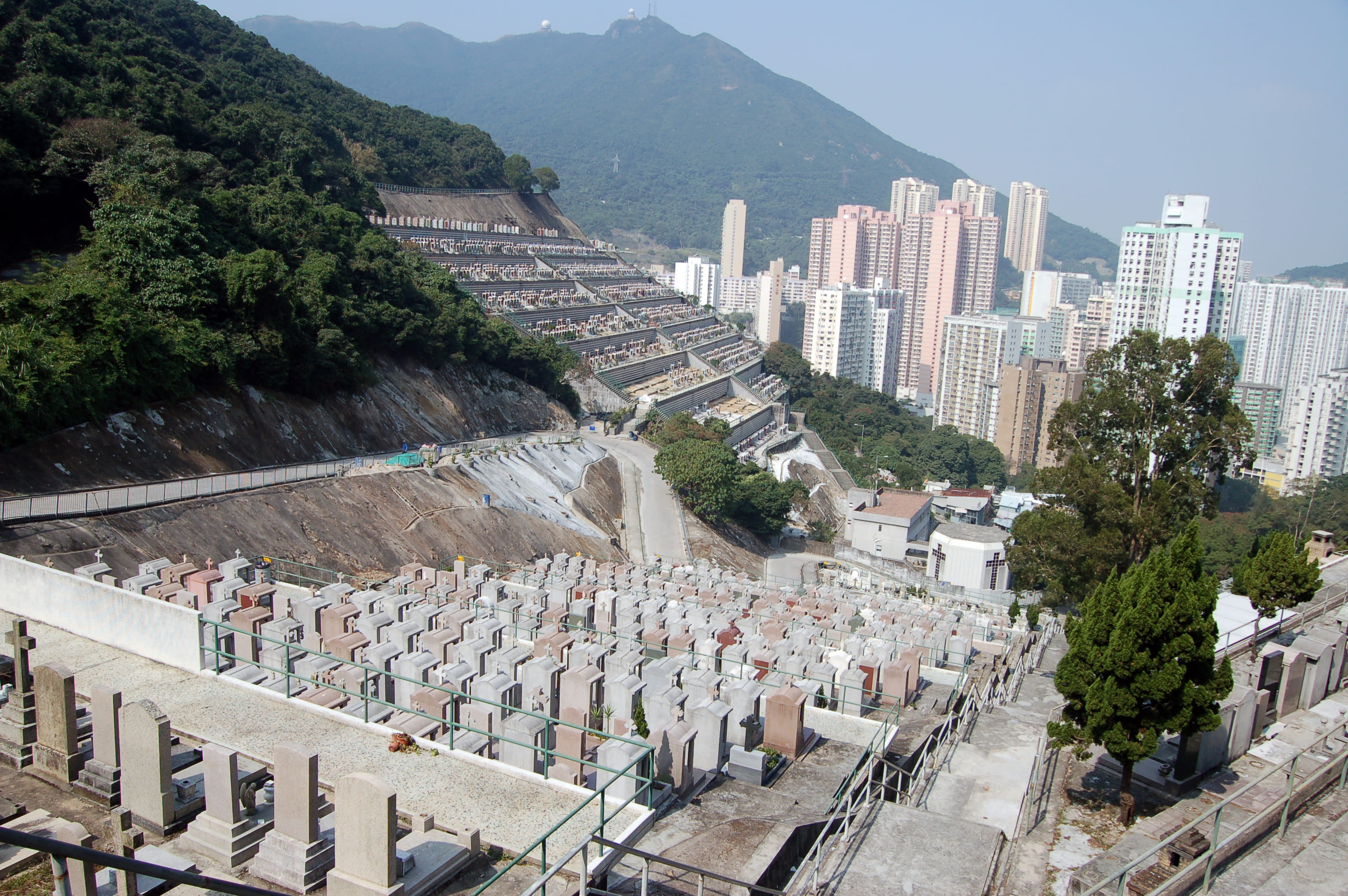 Density in life and in death: A look at Hong Kong's towering cemeteries ...