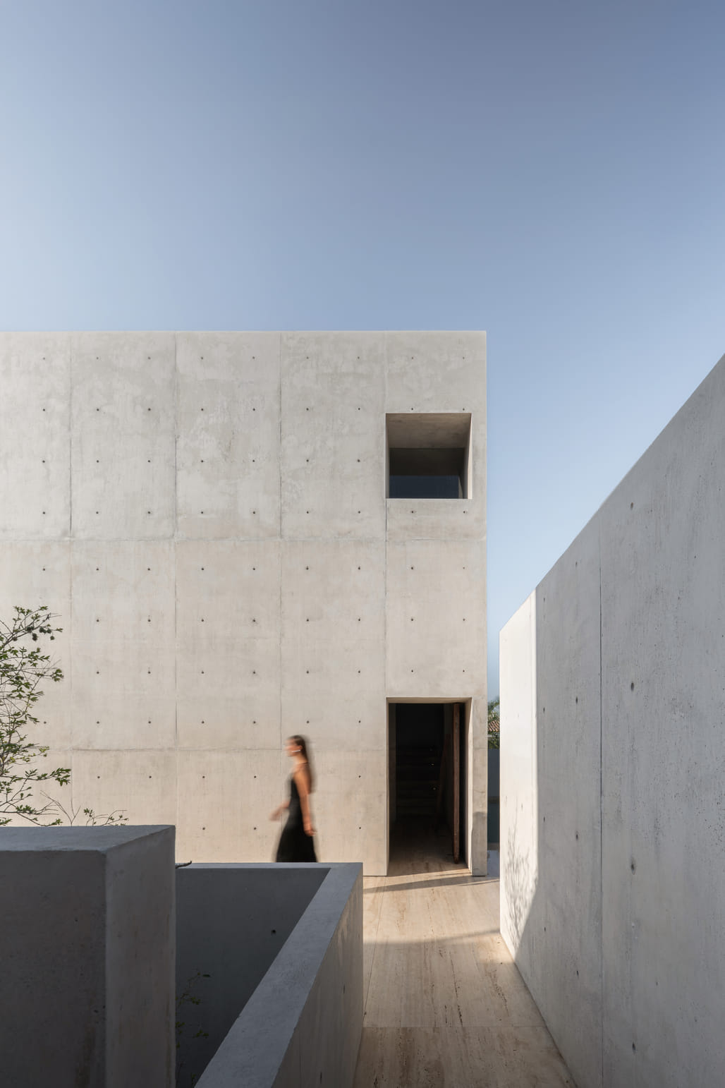 A minimalist concrete home defined by shaded courtyards and stillness ...