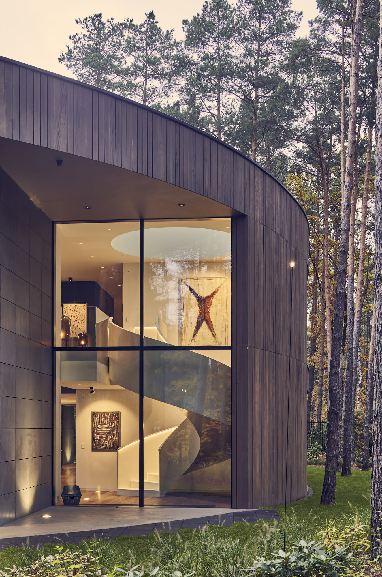 In a Polish forest, Mobius Architekci Studio creates a timber-clad home ...