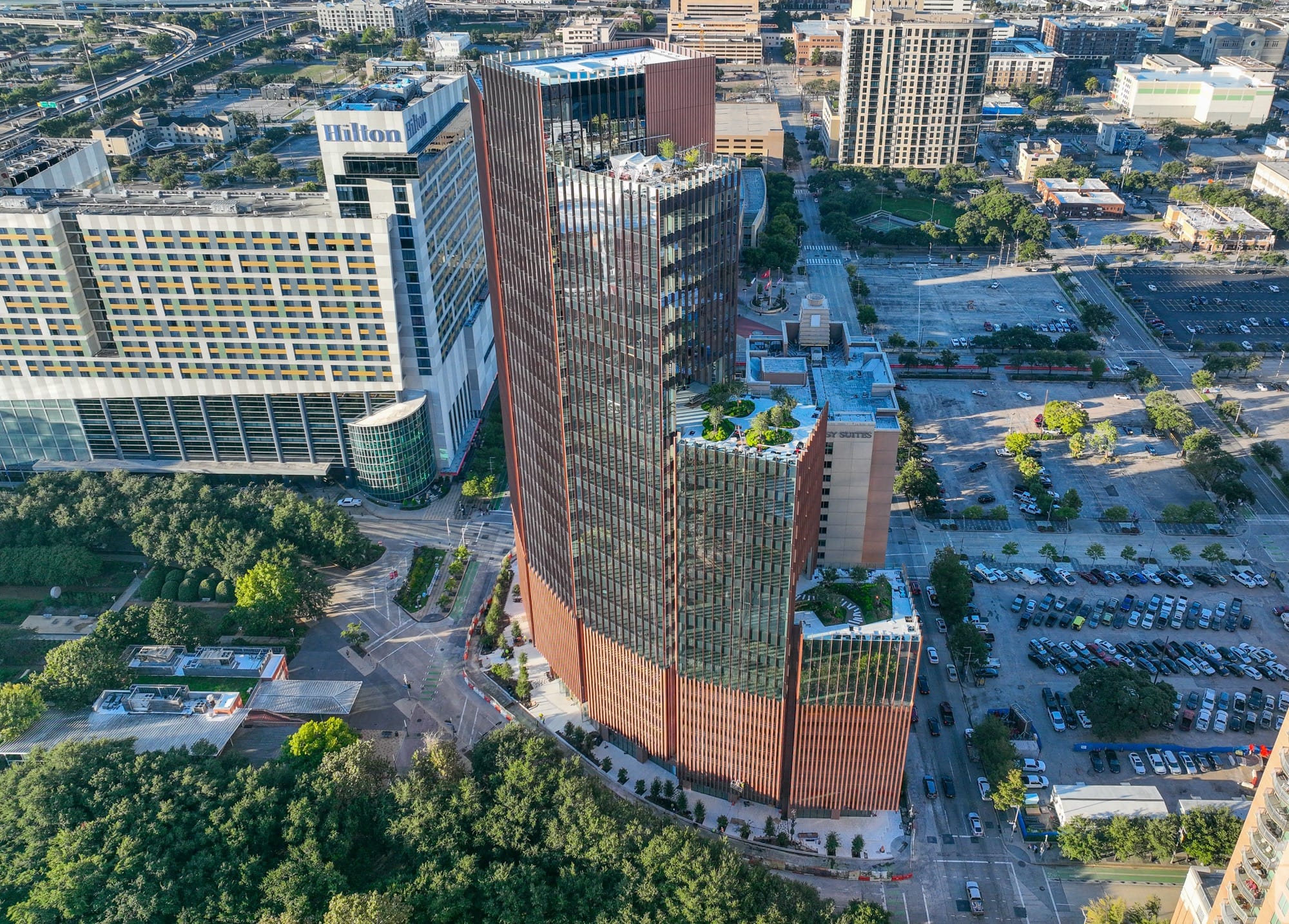 Skanska and BIG complete curving terracotta-colored tower in Houston ...