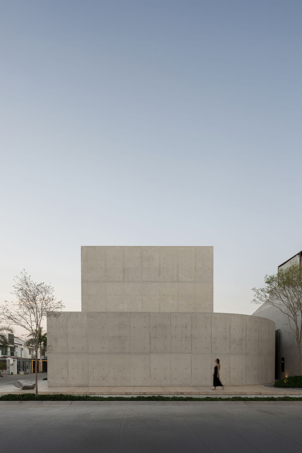 A minimalist concrete home defined by shaded courtyards and stillness ...