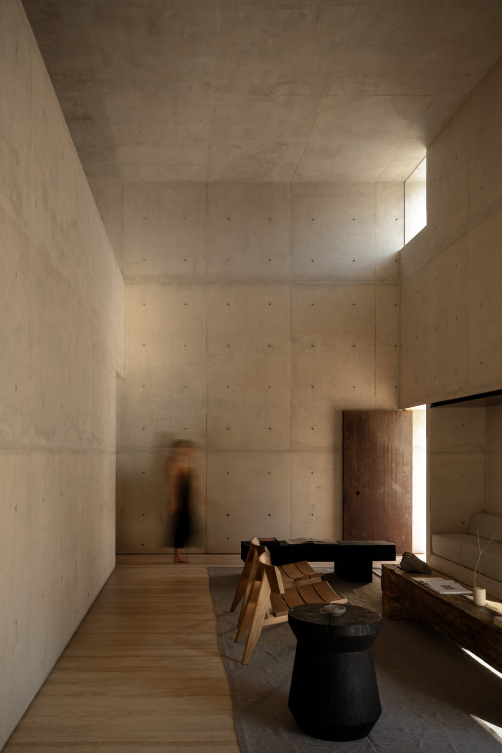 A minimalist concrete home defined by shaded courtyards and stillness ...