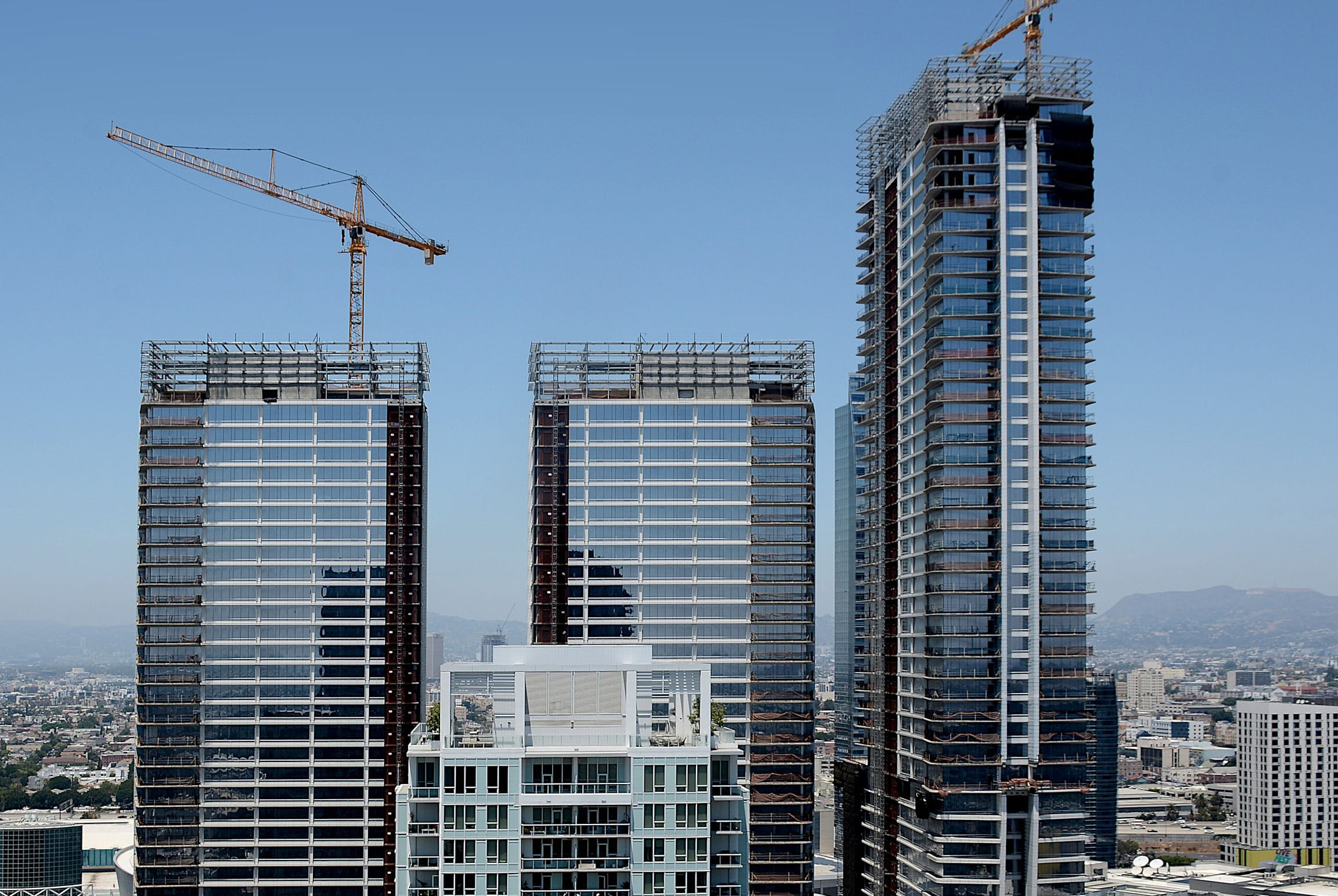 LA City Council orders graffiti removal on infamous unfinished Oceanwide Plaza towers | News ...
