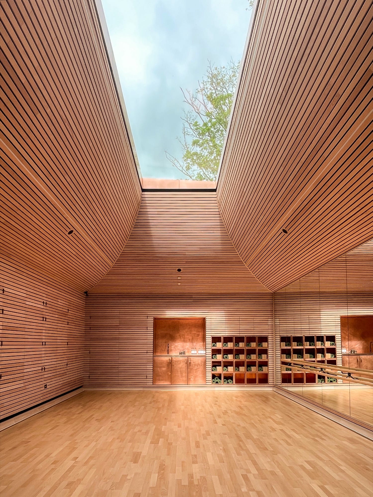 Invisible Studio creates rammed stone yoga studio in UK countryside ...