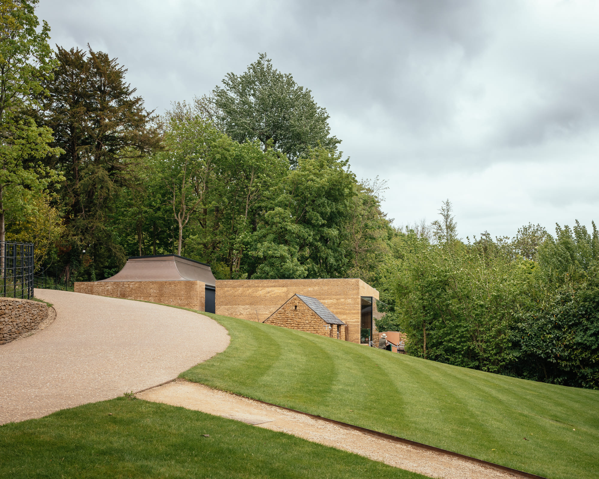 Invisible Studio creates rammed stone yoga studio in UK countryside ...