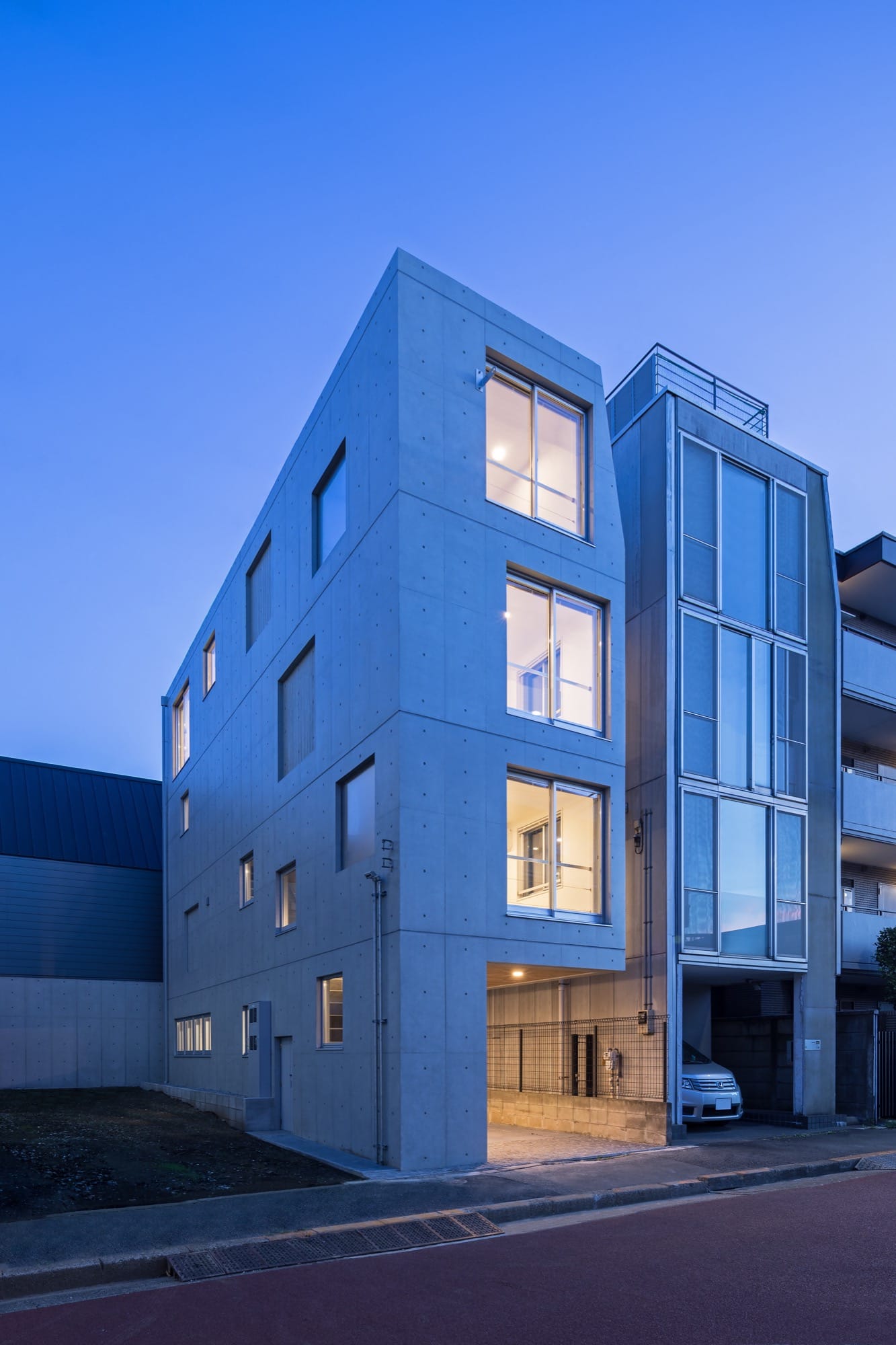 Minimalist concrete apartments fill a narrow site in Tokyo, designed by ...