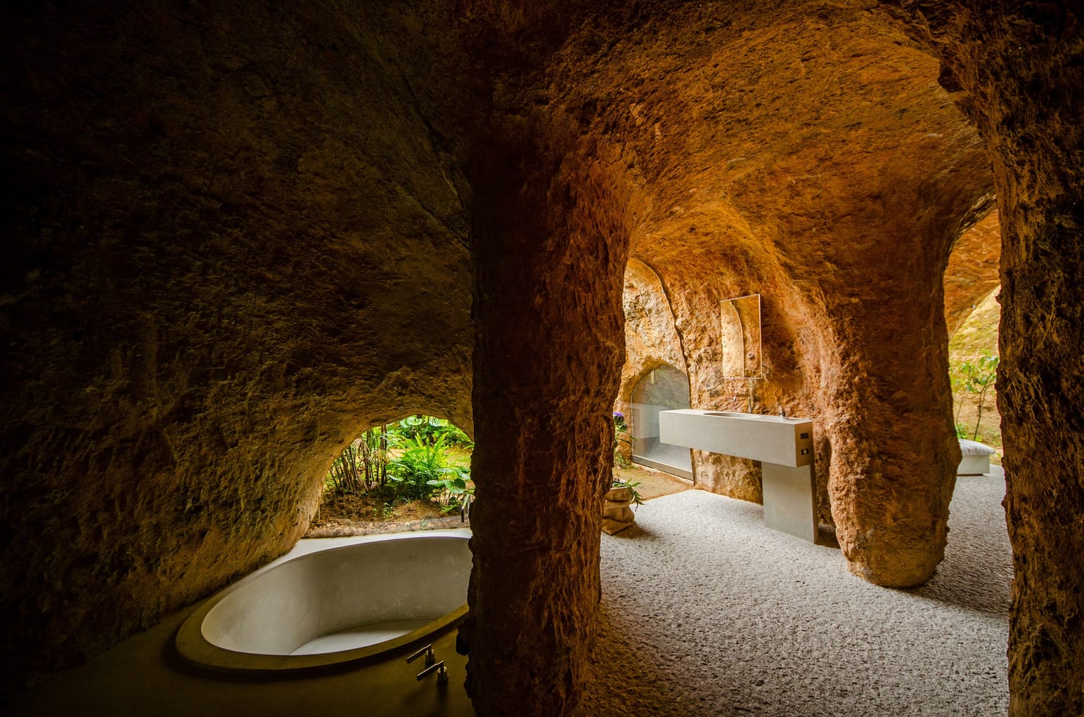 Junya Ishigami 'excavates' concrete cave for restaurant and residence ...