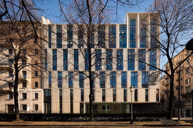 Iotti + Pavarani Architetti -designed office building fills an entire ...